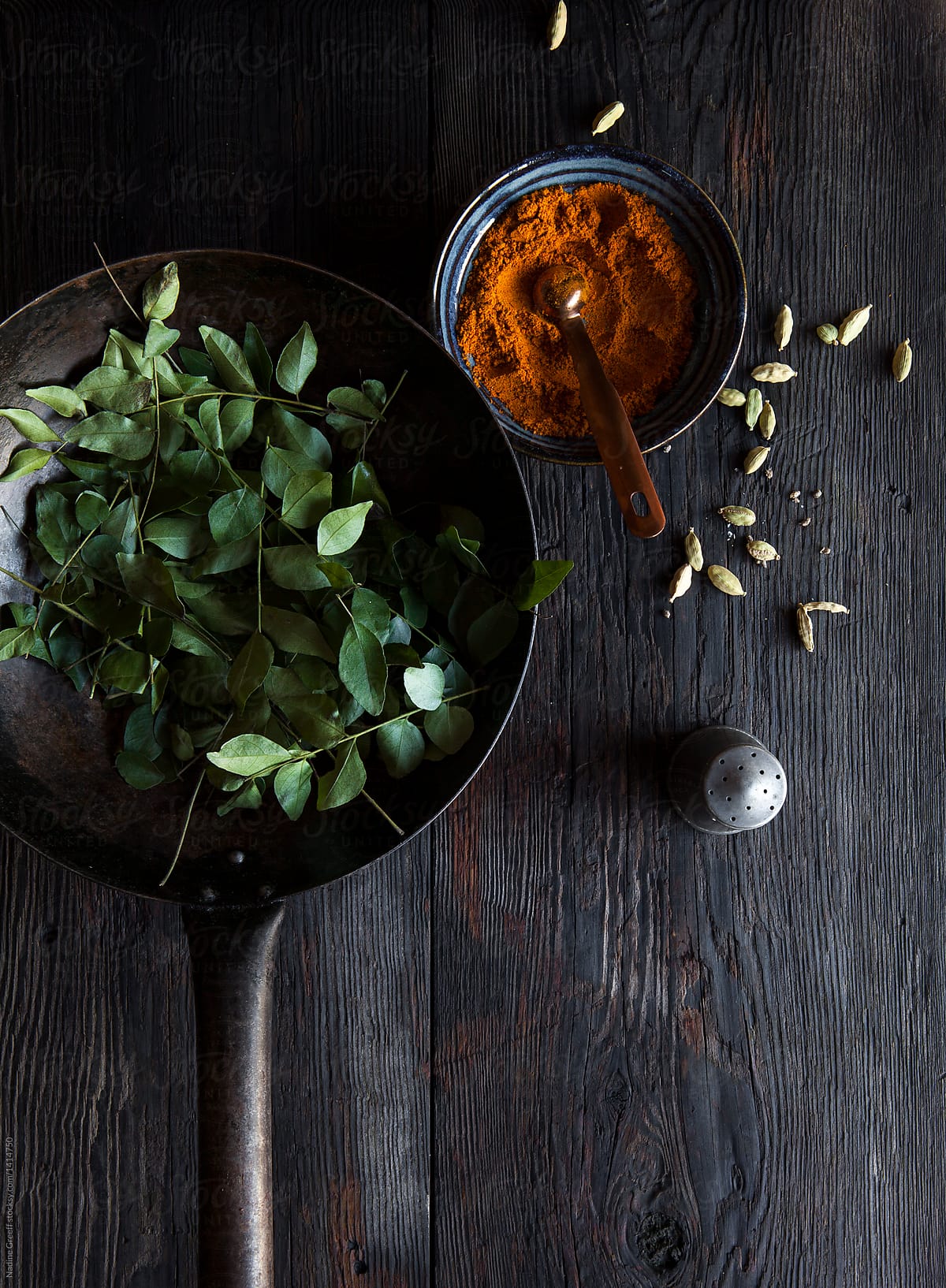 "Fresh Green Curry Leaves, Cardamom Seeds And Curry Spice" by Stocksy ...