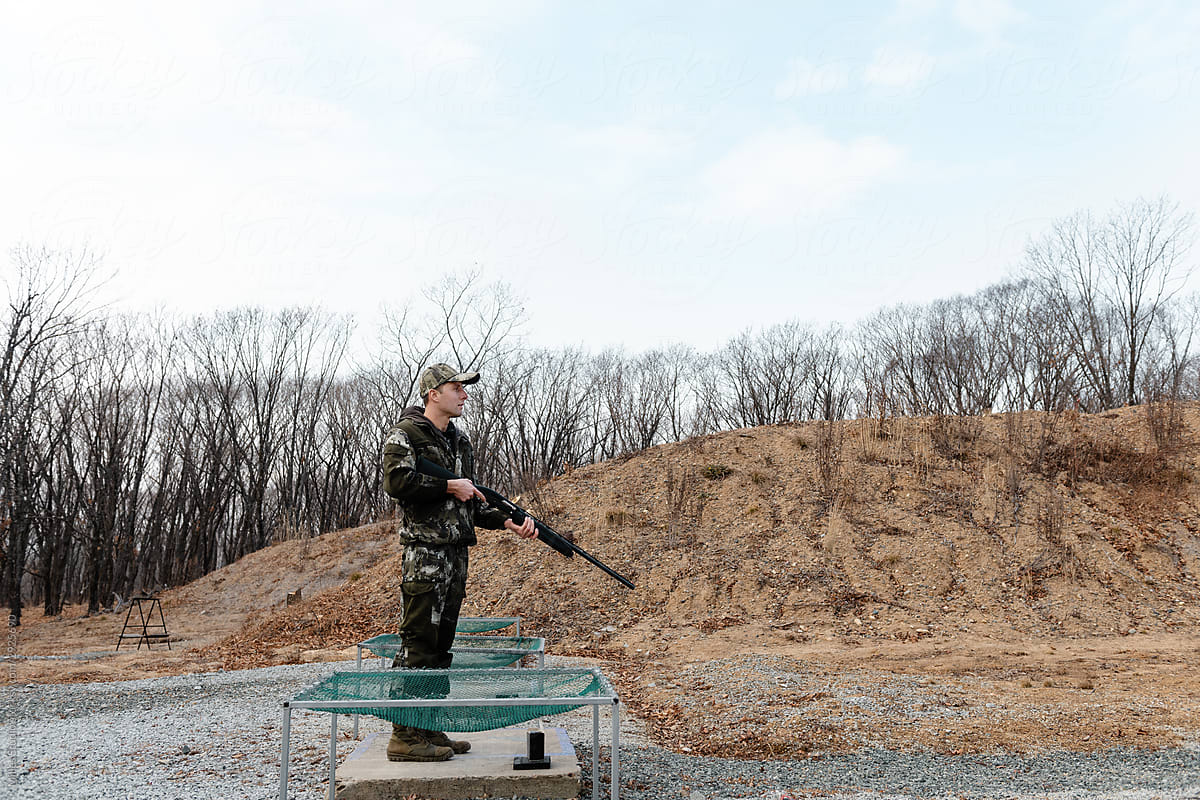"Man On Firing Ground After Shot" by Stocksy Contributor "Milles Team ...