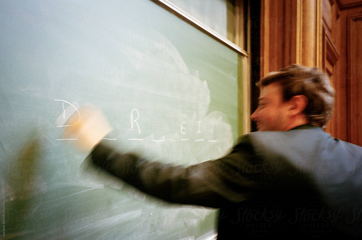 "Professor Writing In A Blackboard" by Stocksy Contributor "Luciano ...