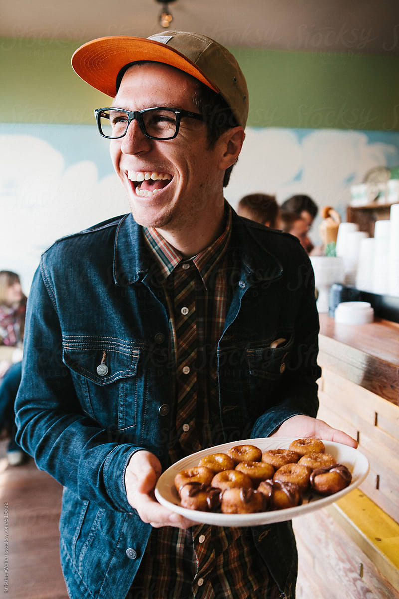 "Man Excited About Mini Donuts" by Stocksy Contributor "Kristine ...