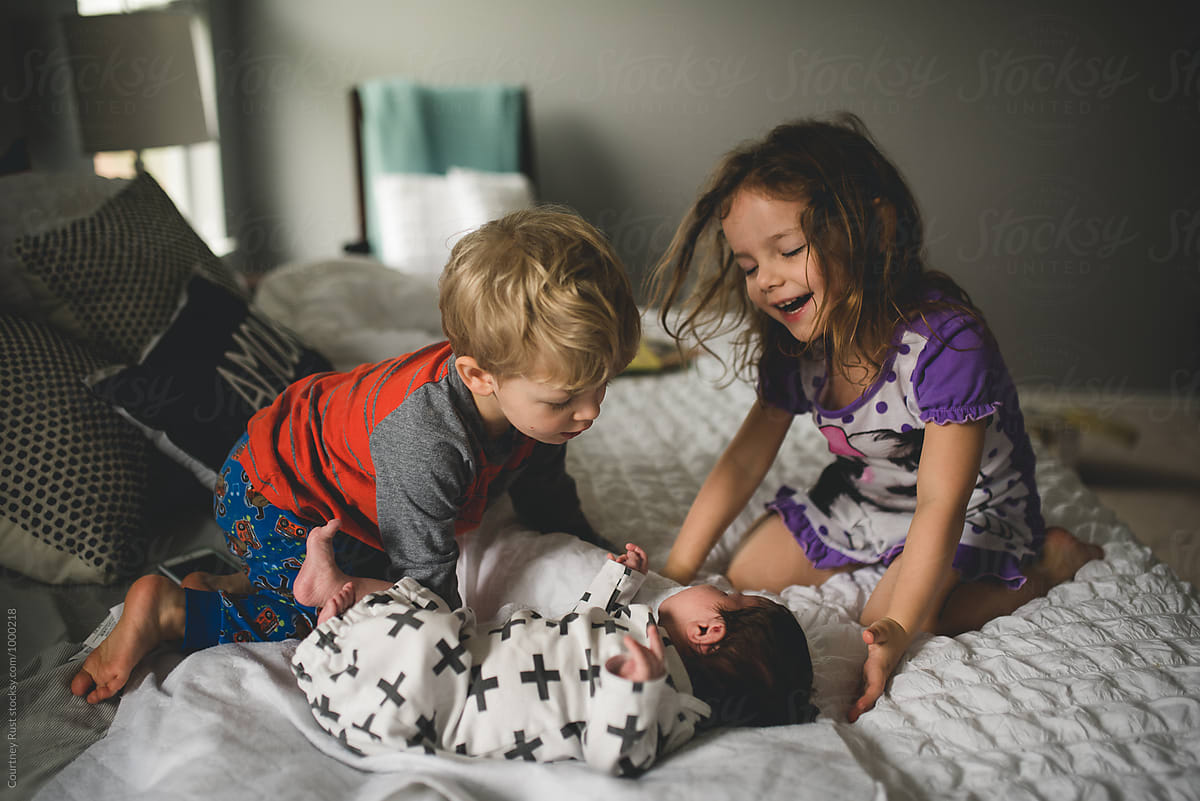 "Adoring Newborn Baby On Bed" by Stocksy Contributor "Courtney Rust ...