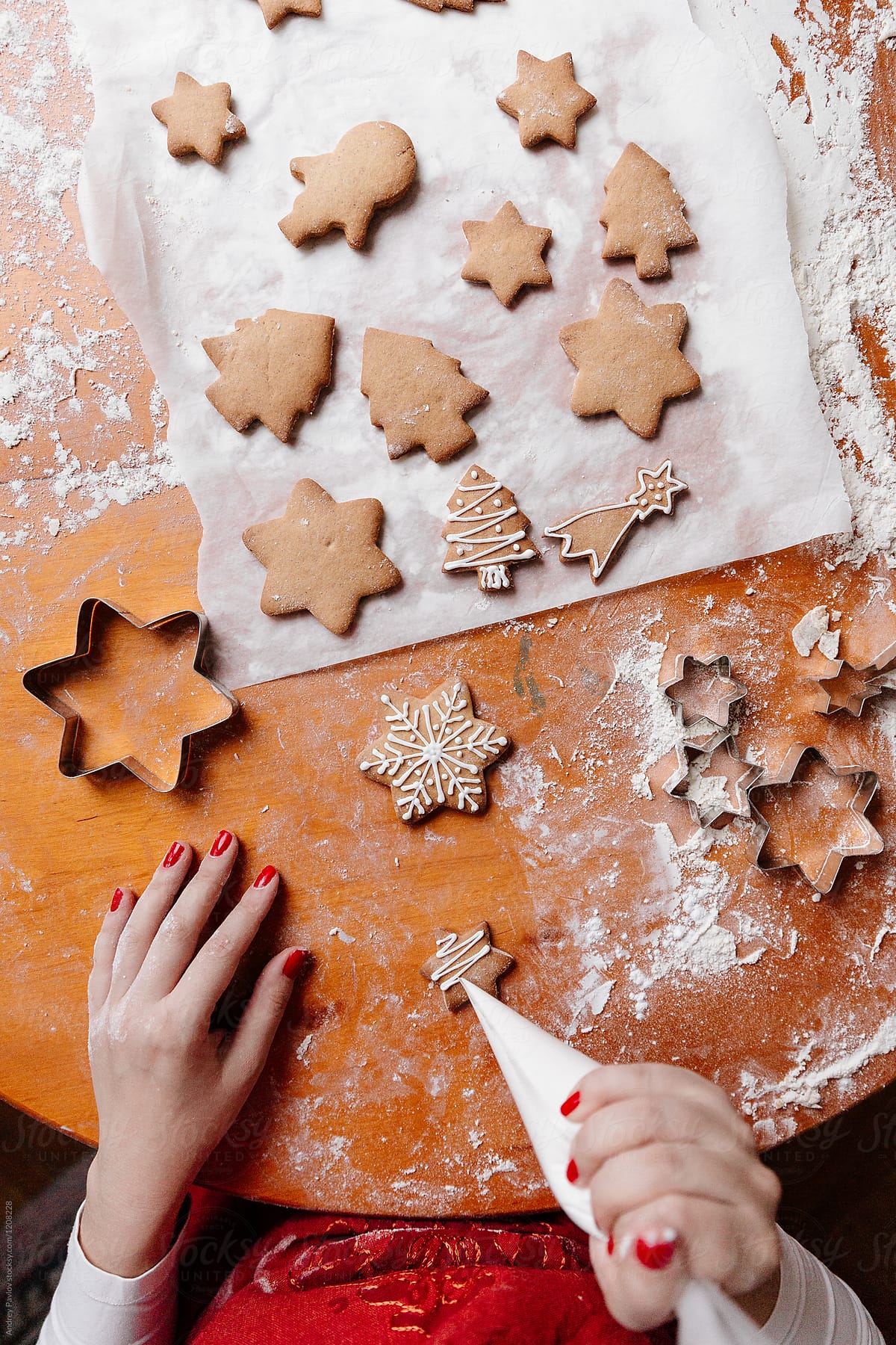 "Woman Decorating Christmas Cookies" by Stocksy Contributor "Andrey ...