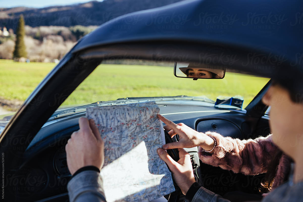 "Couple Looking At The Road Map" by Stocksy Contributor "Michela ...