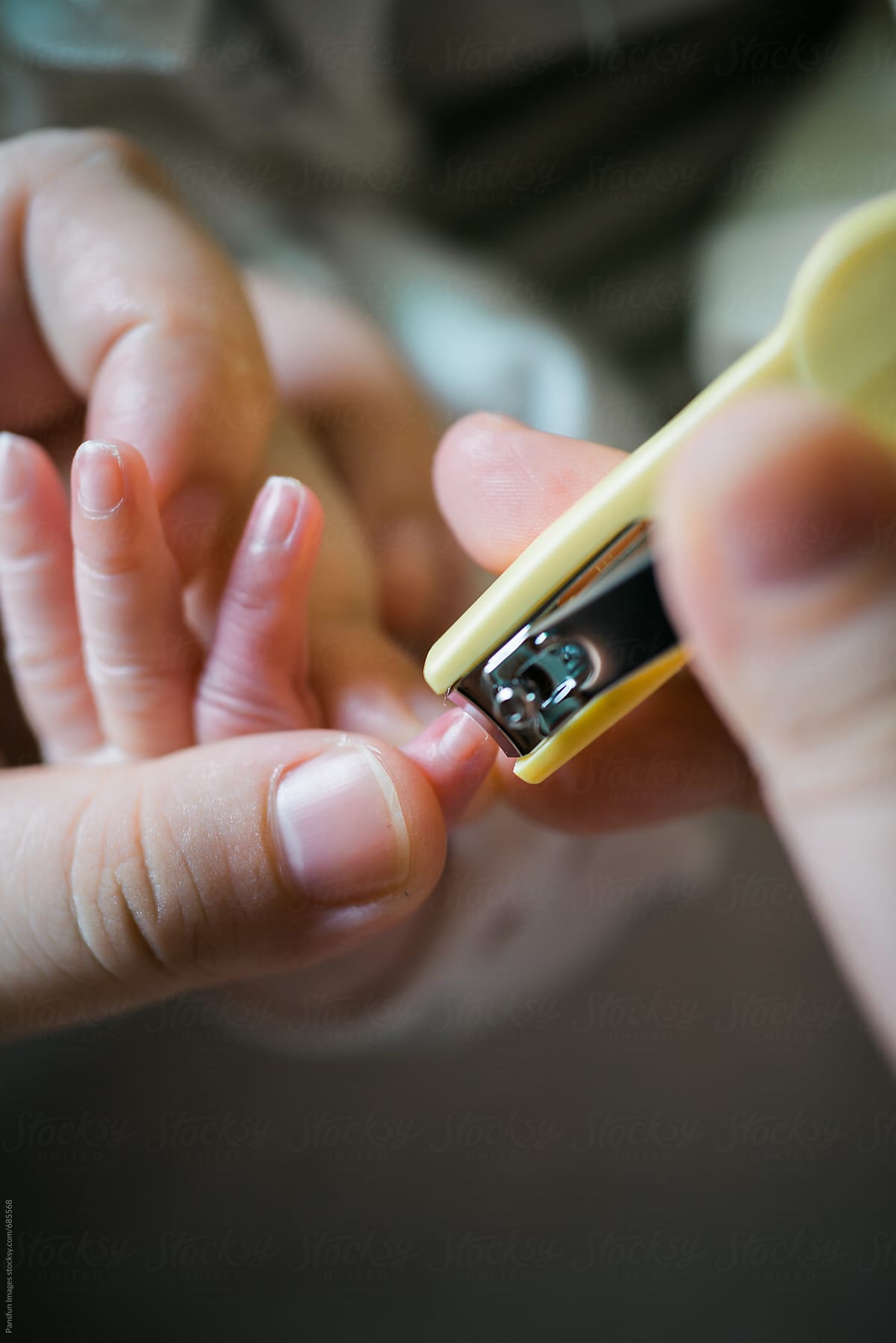 "Cut The Baby Nails" by Stocksy Contributor "Pansfun Images" - Stocksy