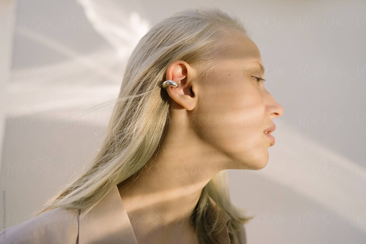 "Woman Standing In Shades Of Sunlight" by Stocksy Contributor "Vradiy ...
