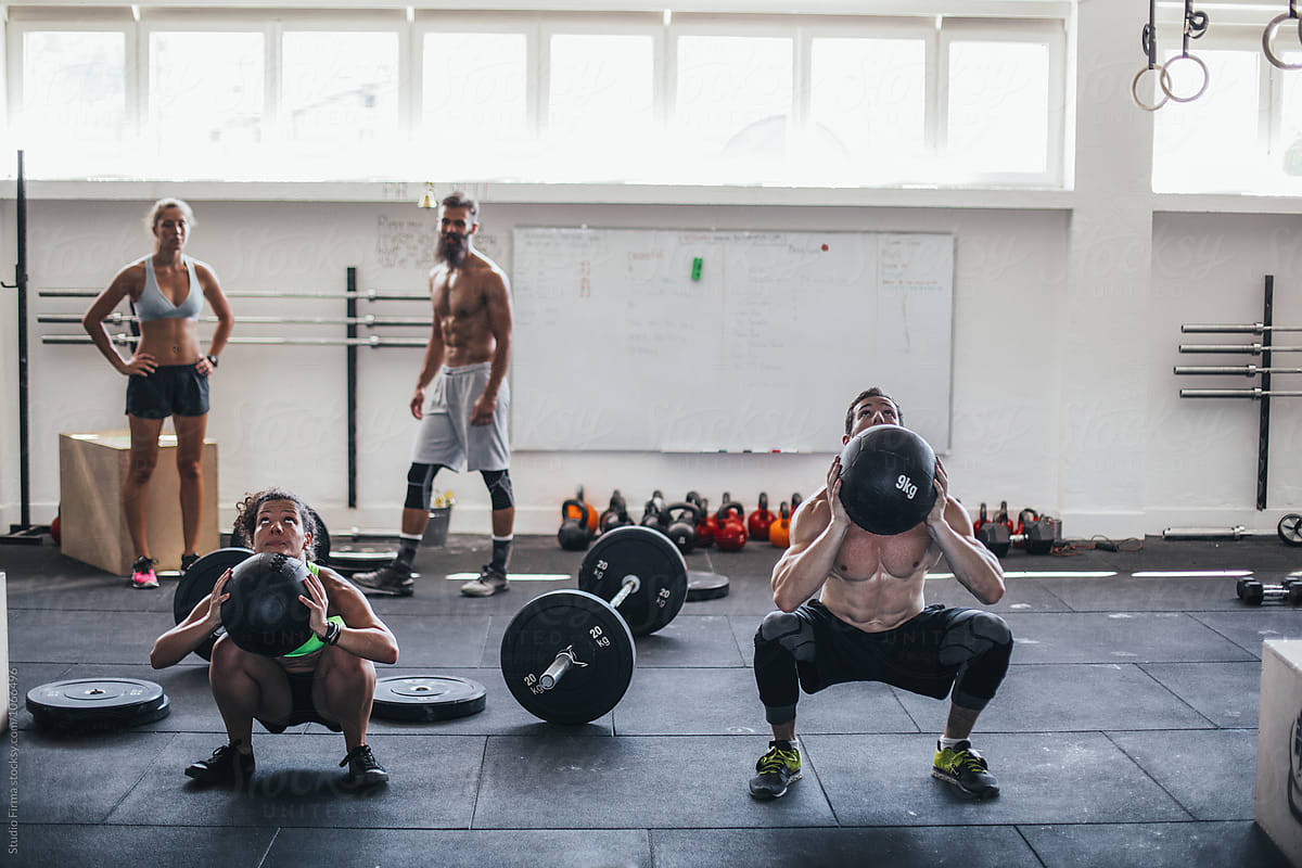 "Group Workout In The Gym" by Stocksy Contributor "Studio Firma" - Stocksy