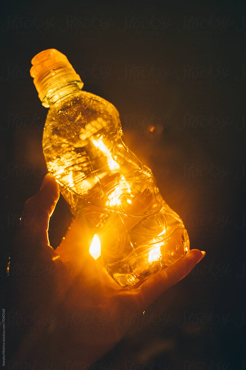 "Glowing Water Bottle Illuminated With Warm Light" by Stocksy ...