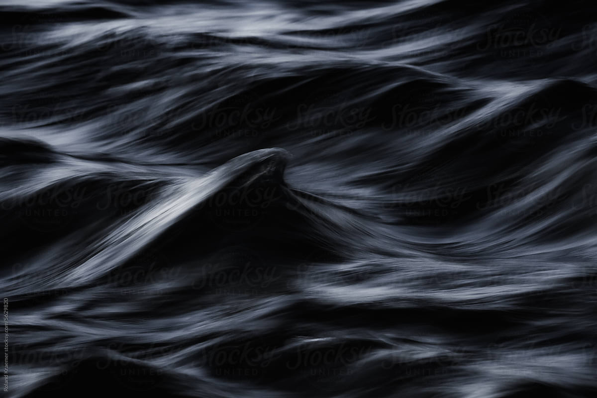 "Dark Wave In Motion" by Stocksy Contributor "Roland Kraemer" - Stocksy
