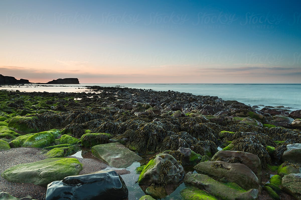 "Saltwick Bay Beach At Sunset" by Stocksy Contributor "Marilar ...