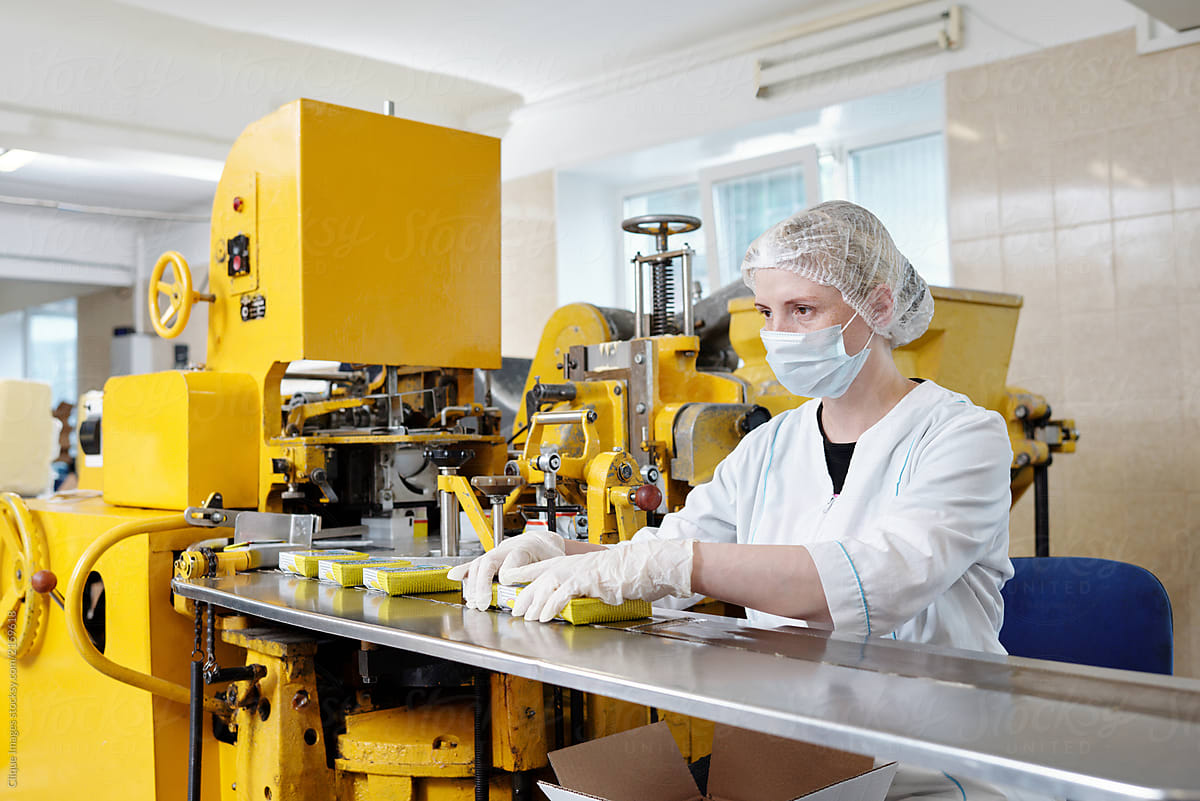 "Package Handler Working At Conveyor" by Stocksy Contributor "Clique ...