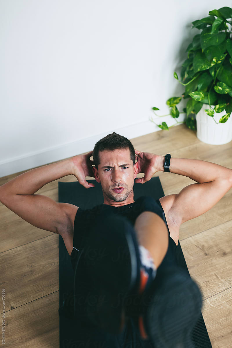 "Young Man Doing Training Exercises At Home." by Stocksy Contributor ...