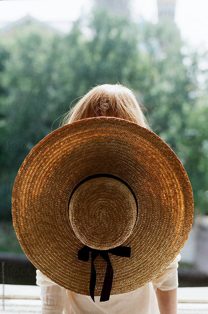 "Back View Of A Woman With Straw Hat" by Stocksy Contributor "Amor ...