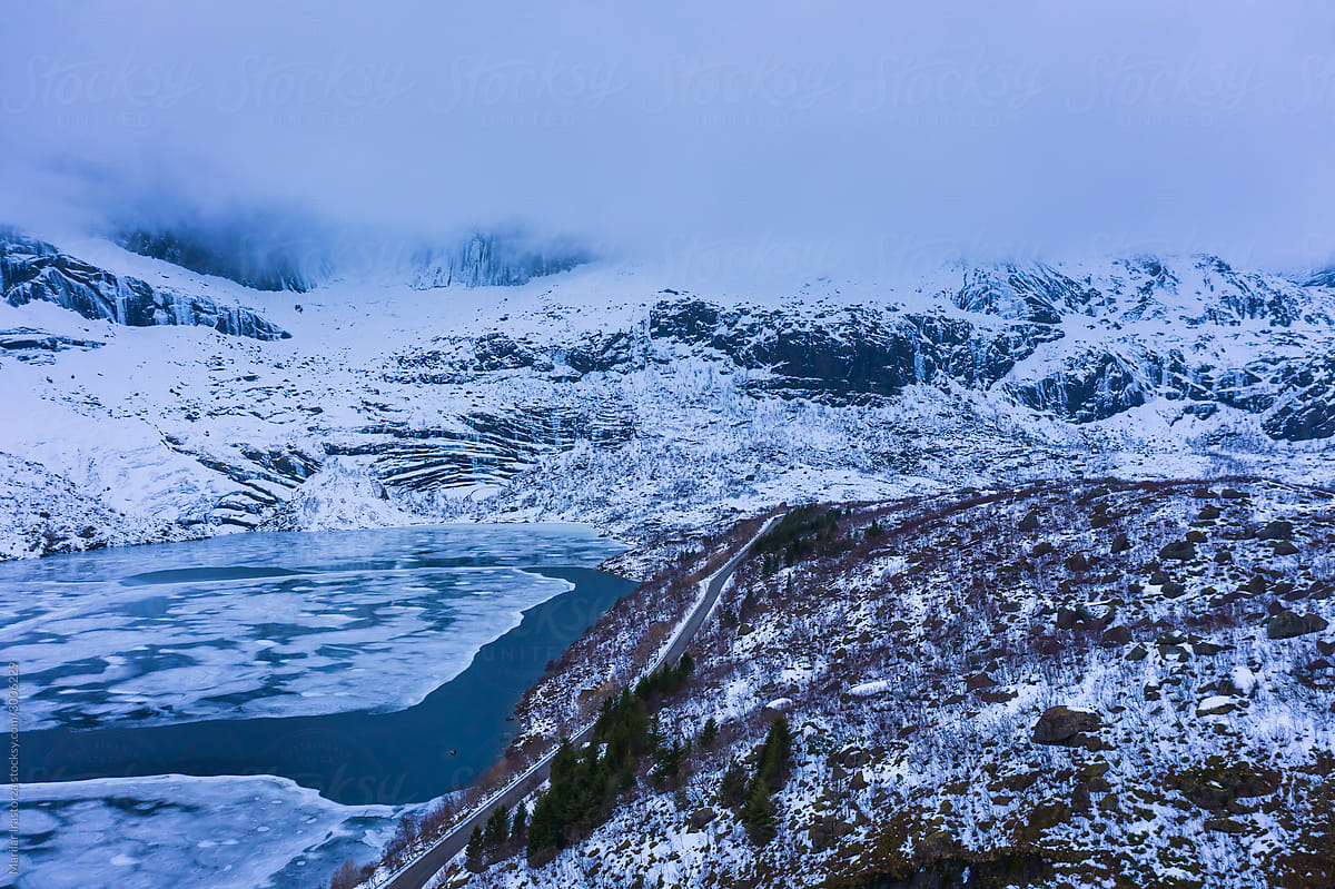 "Icy Lake And Snowy Mountains At Sunset" by Stocksy Contributor ...