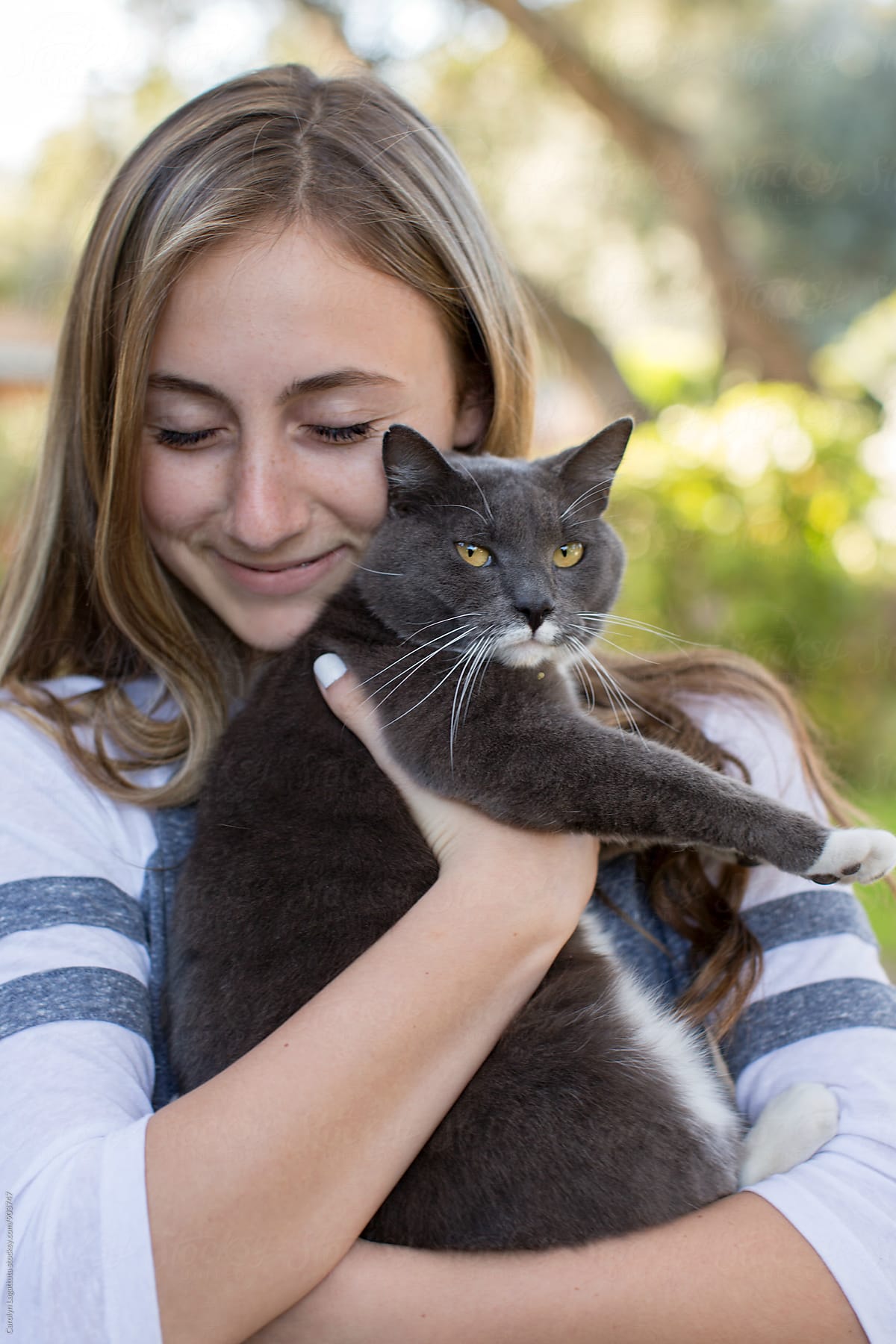 "Teenage Girl Hugging A Grey Cat" by Stocksy Contributor "Carolyn ...