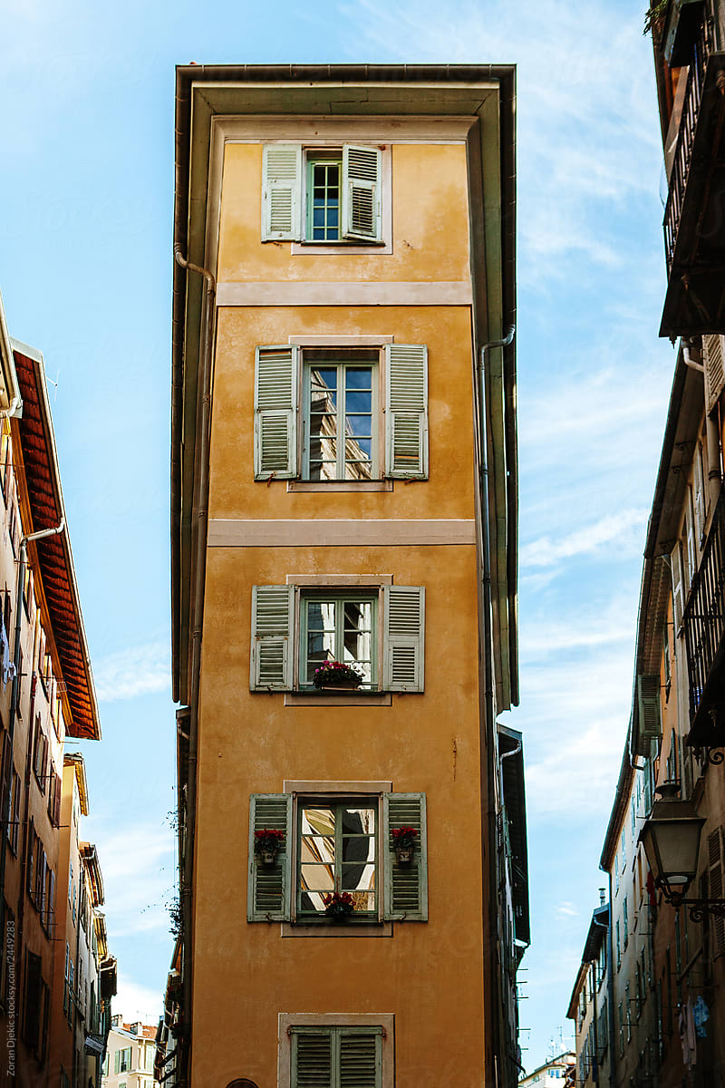 "Narrow Yellow Building In Old Town Nice" by Stocksy Contributor "Zoran ...