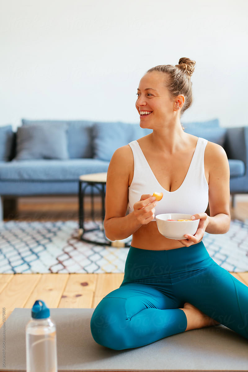 "Happy Sportswoman Snacking During Training" by Stocksy Contributor ...