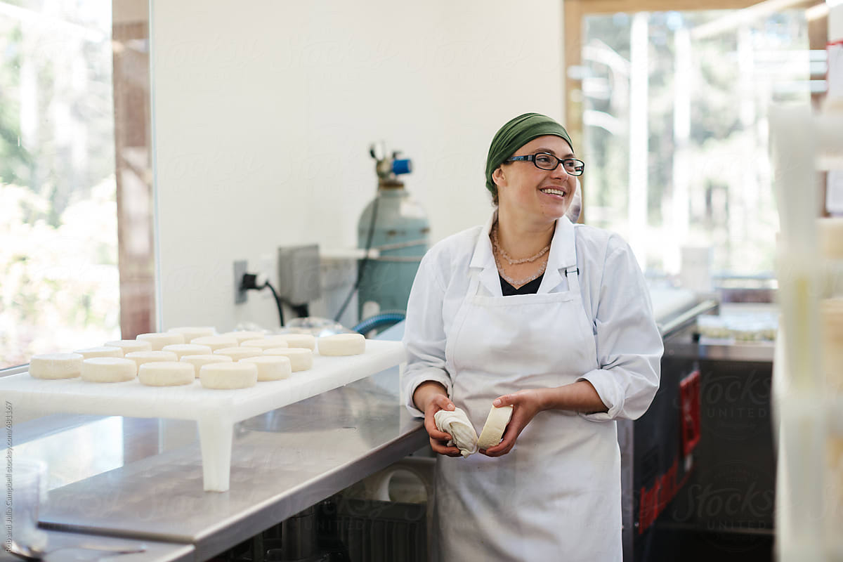 "Happy Portrait Of Woman Working In Cheese Kitchen" by Stocksy ...