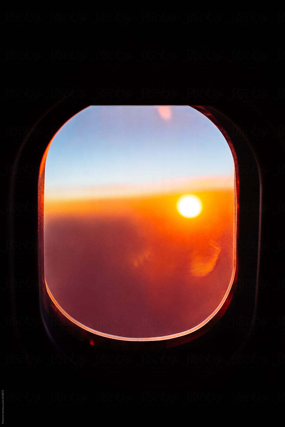 "Sunset Through An Airplane Window" by Stocksy Contributor "Mosuno ...