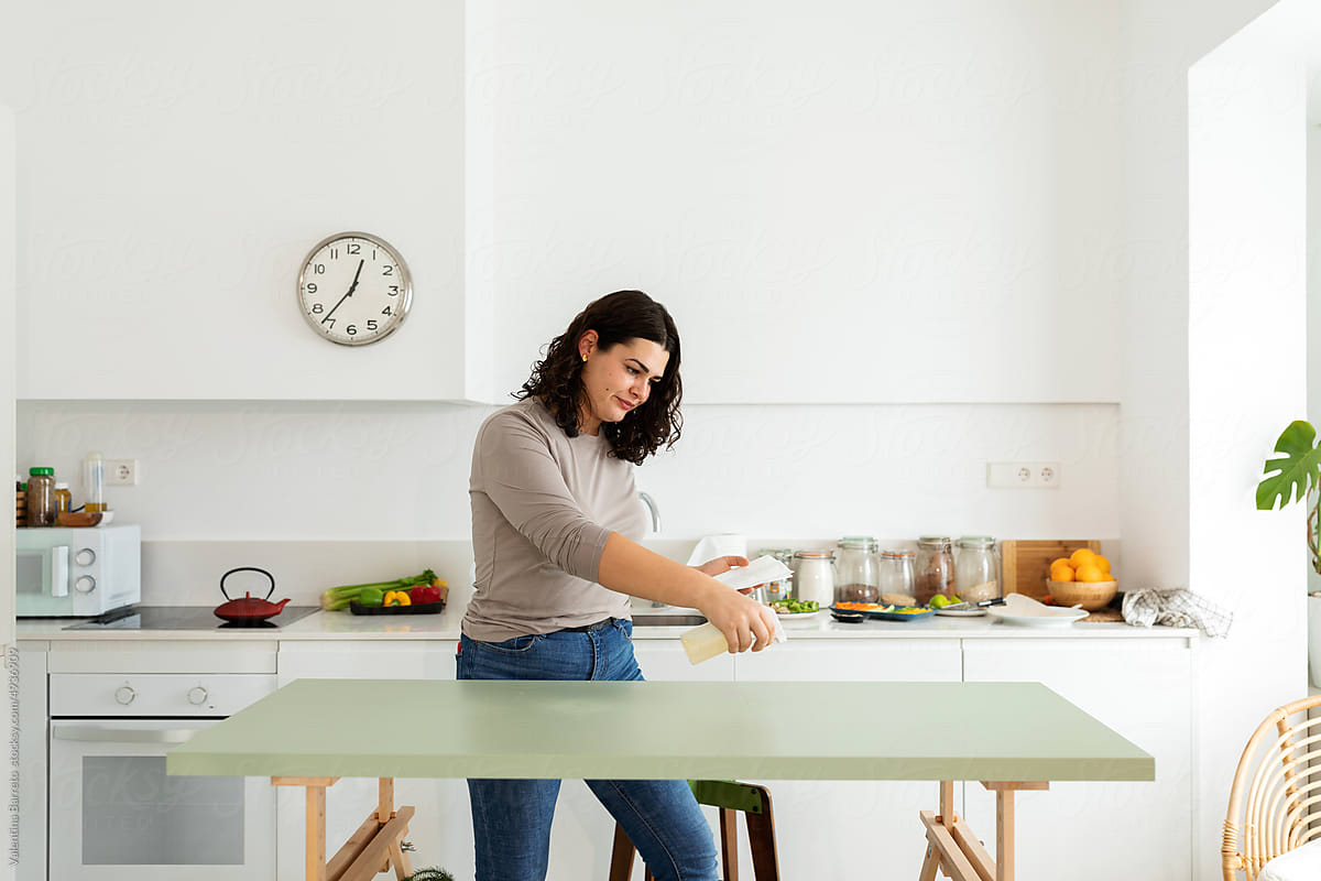 "Trans Woman Cleaning At Kitchen" by Stocksy Contributor "valbar STUDIO ...