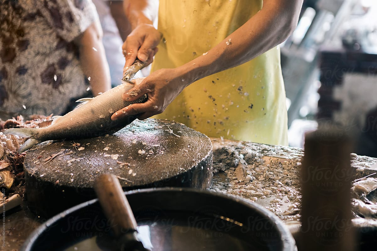 "Fishmonger Deboning And Descaling Milkfish Or Bangus In A Market In ...
