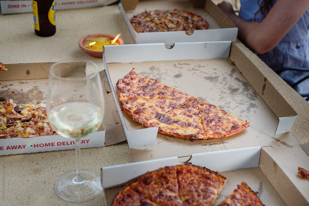 "Takeaway Pizzas" by Stocksy Contributor "Gillian Vann" - Stocksy