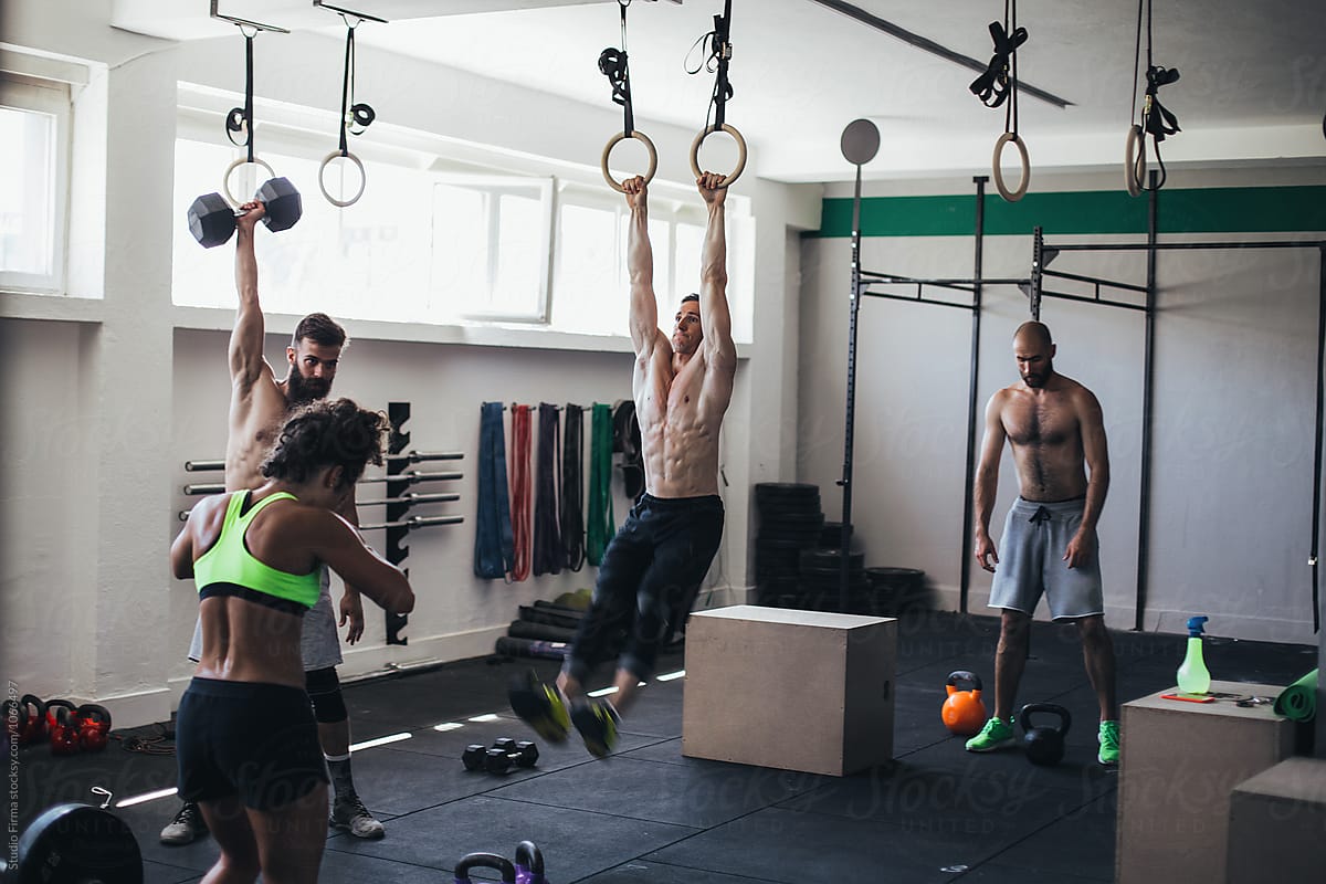 "Group Workout In The Gym" by Stocksy Contributor "Studio Firma" - Stocksy