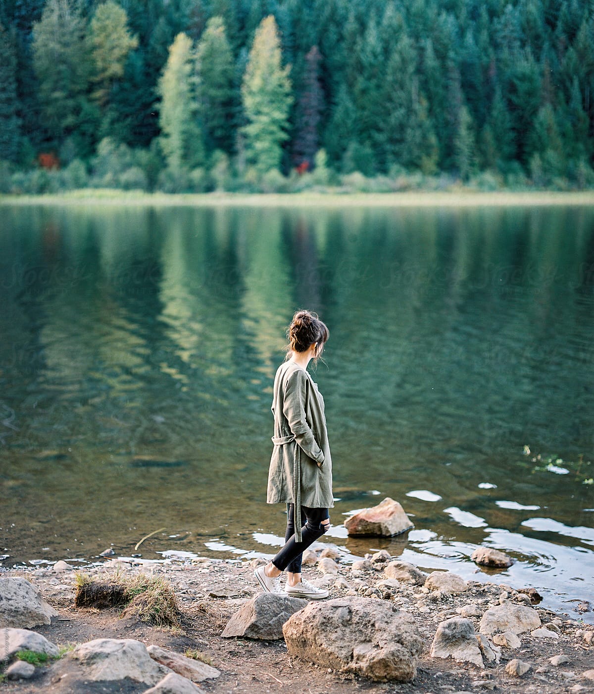 "Young Woman Walking Along Lake" by Stocksy Contributor "Daniel Kim ...