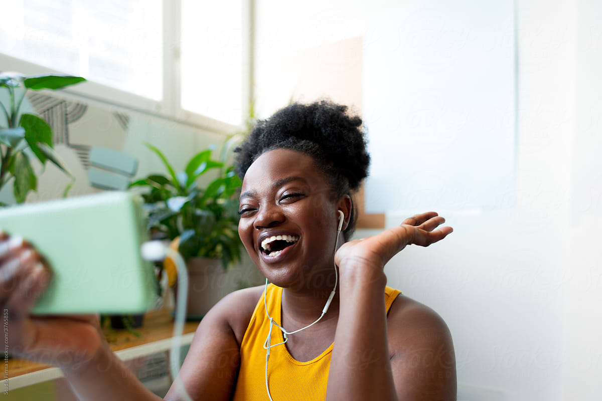 "Woman On Video Call" by Stocksy Contributor "Studio Firma" - Stocksy