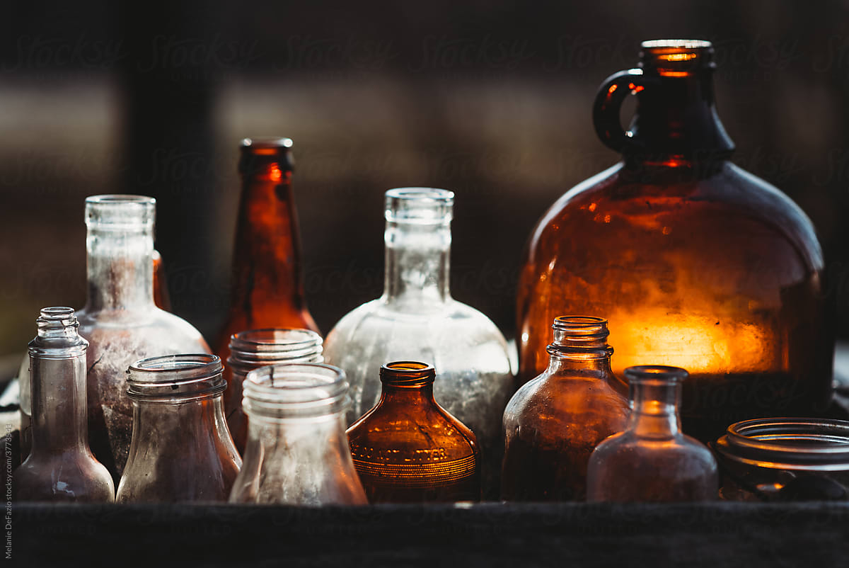 "Old Glass Bottles" by Stocksy Contributor "Melanie DeFazio" - Stocksy
