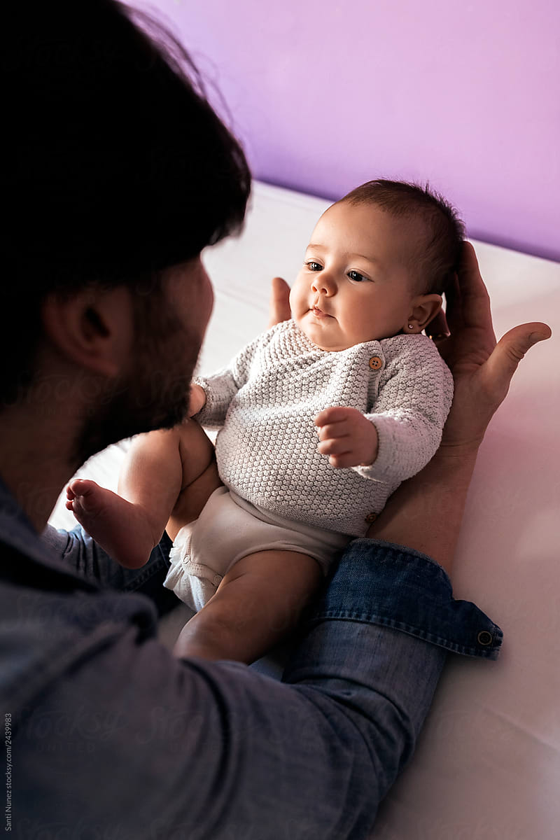 "Father And His Baby Having Fun At Home" by Stocksy Contributor "Santi ...