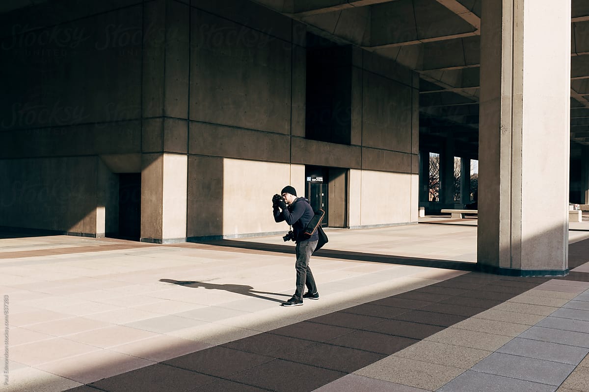 "Man Taking Photographs Near Modern Buildings" by Stocksy Contributor ...