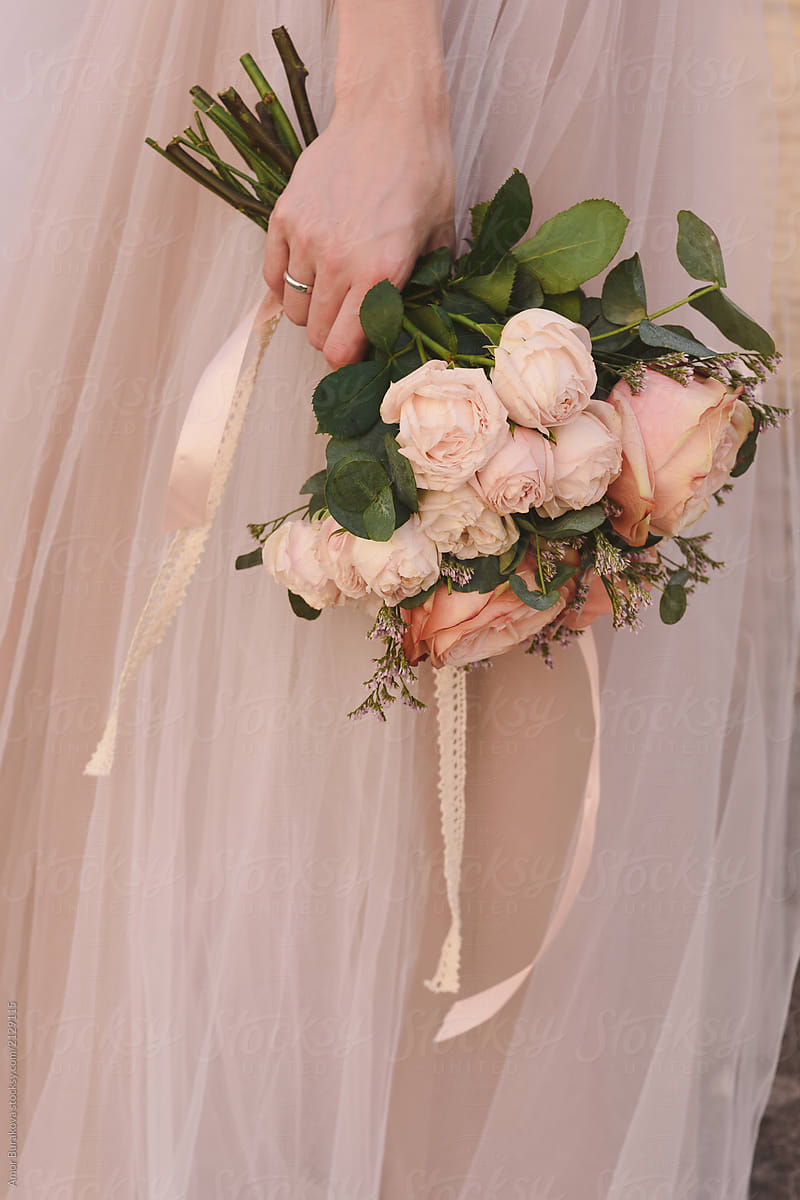 "Bride Holding Bouquet Of Roses" by Stocksy Contributor "Amor Burakova ...