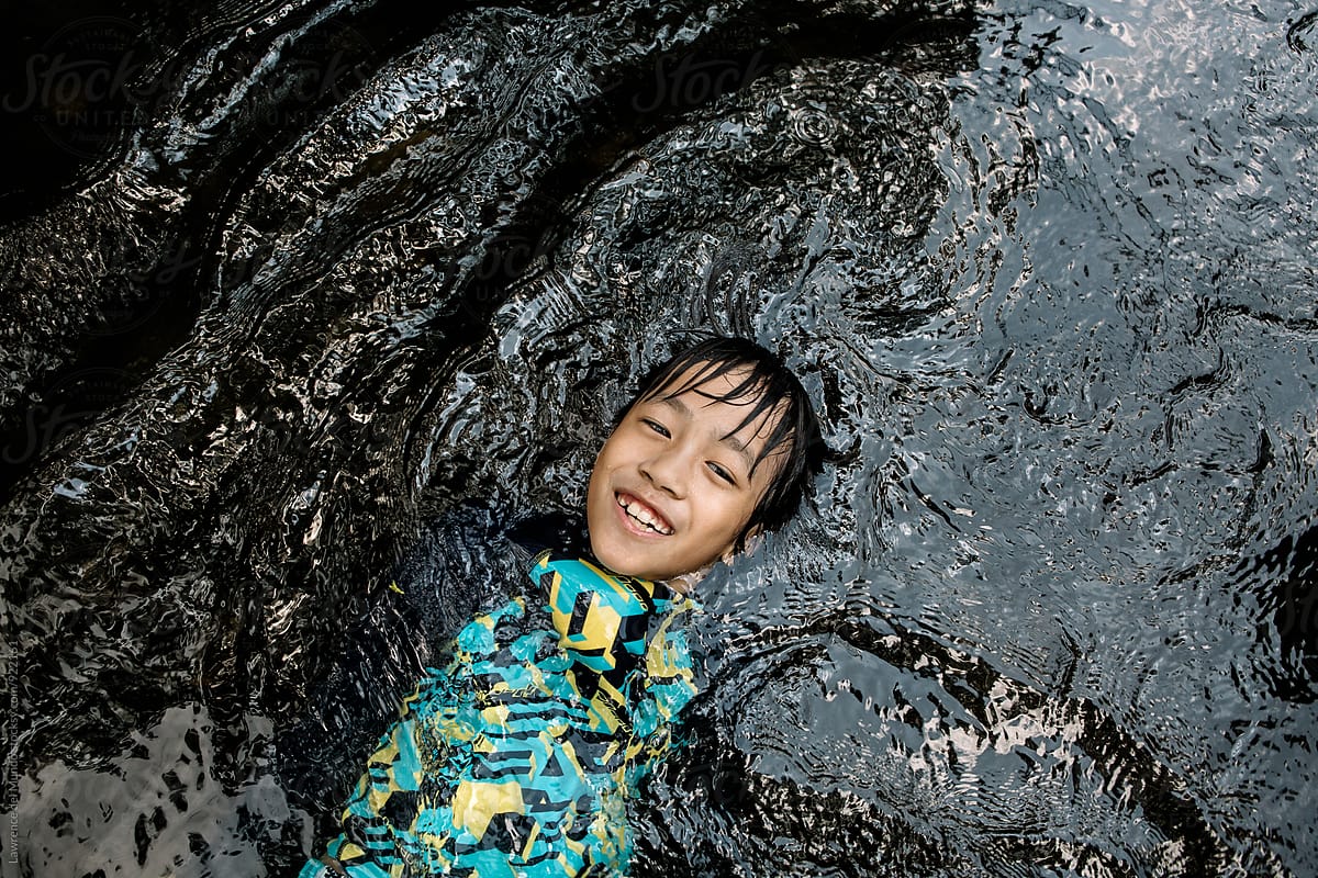"Young Boy Enjoying A Swim In The River" by Stocksy Contributor ...