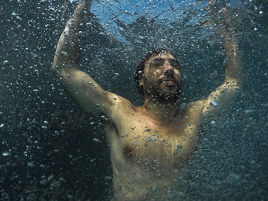 Man Floating Underwater Young Man Floating In Water | Colourbox