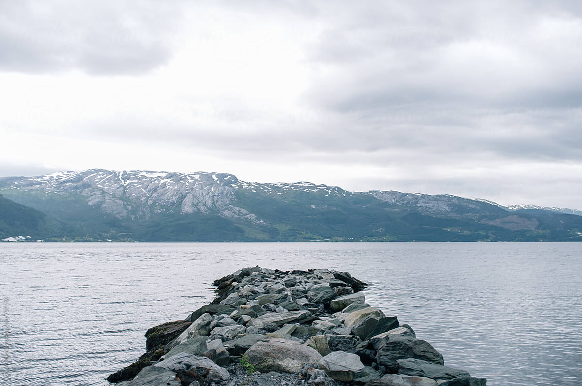 "Stone Pier In The Sea" by Stocksy Contributor "Tomas Mikula" - Stocksy