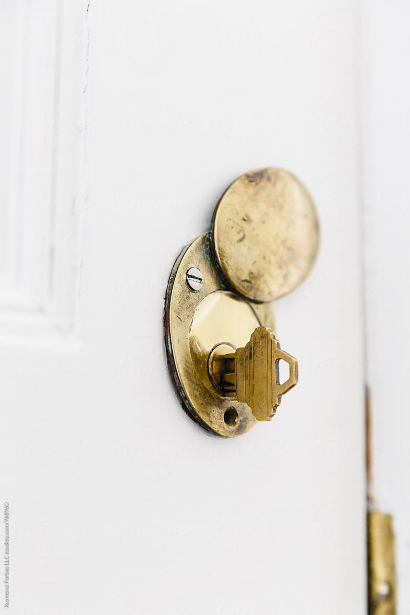 "Brass Door Lock With Key" by Stocksy Contributor "Raymond Forbes LLC ...