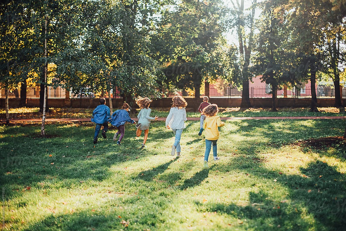 "Kids Running Outdoors" by Stocksy Contributor "Lumina" - Stocksy
