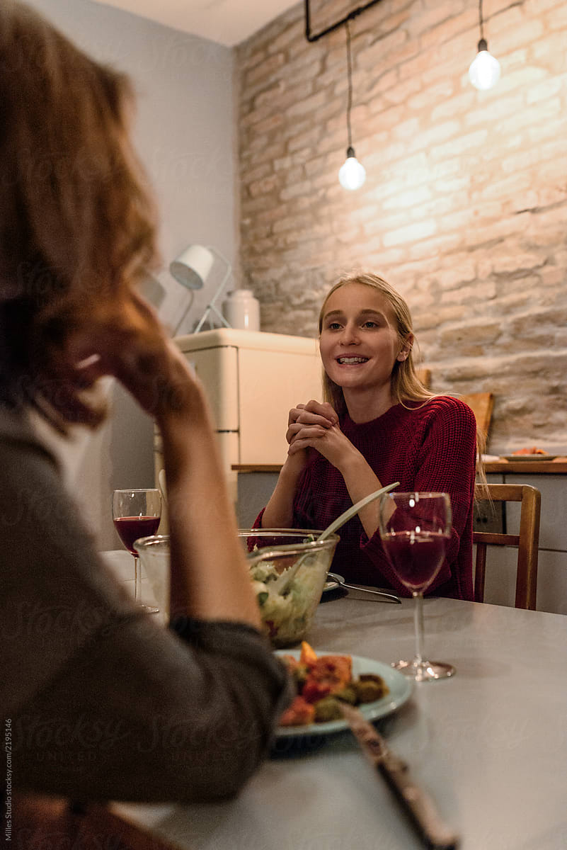 "Casual Women Having Dinner In Kitchen" by Stocksy Contributor "Milles ...