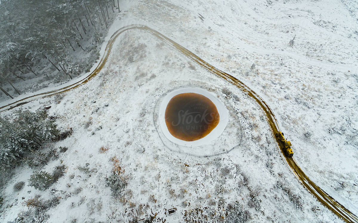 "Water Reservoir In Winter With Winding Road" by Stocksy Contributor ...