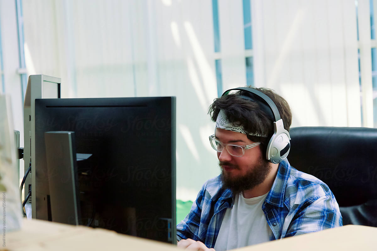 "Bearded Student Using Computer In Classroom" by Stocksy Contributor ...