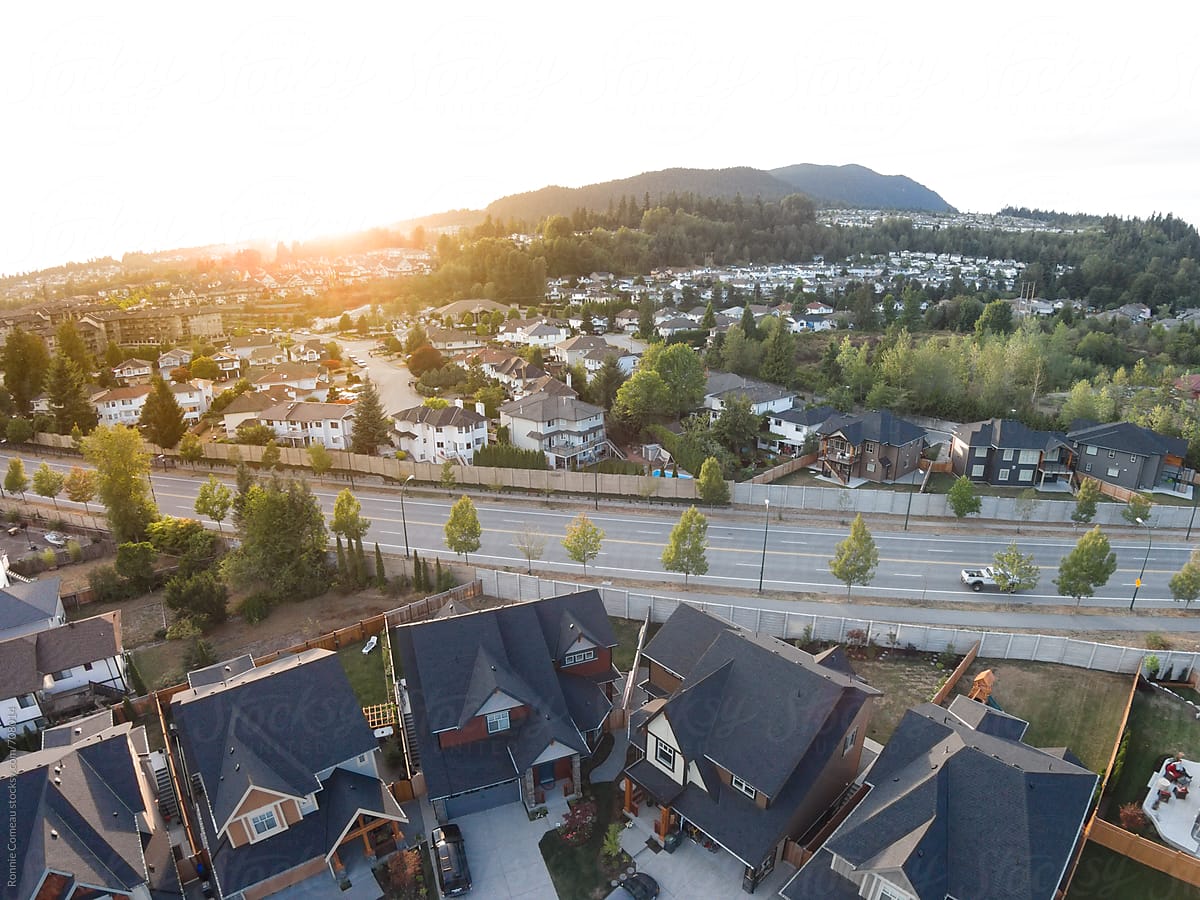 "Sunset On Suburbs" by Stocksy Contributor "Ronnie Comeau" - Stocksy