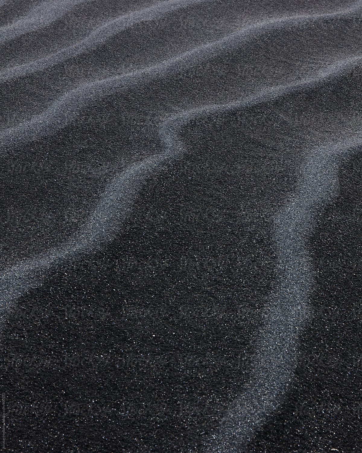 "Patterns In Black Sand" by Stocksy Contributor "Jonatan Hedberg" - Stocksy