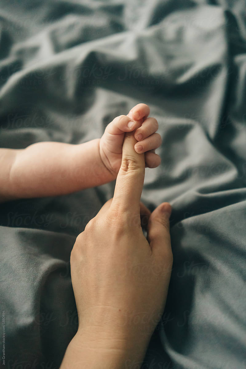 "Baby Grabbing Mom's Finger" by Stocksy Contributor "Jen Grantham ...