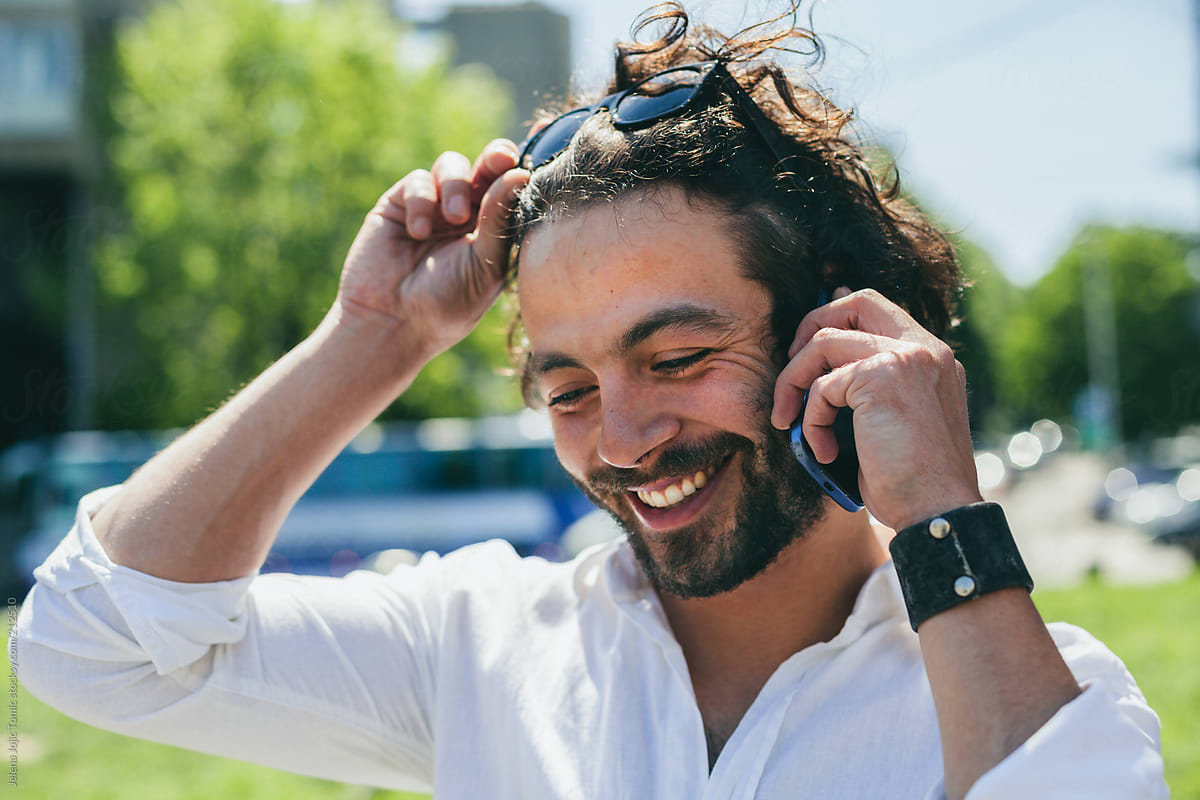 "Young Man Making A Phone Call" by Stocksy Contributor "Jelena Jojic ...