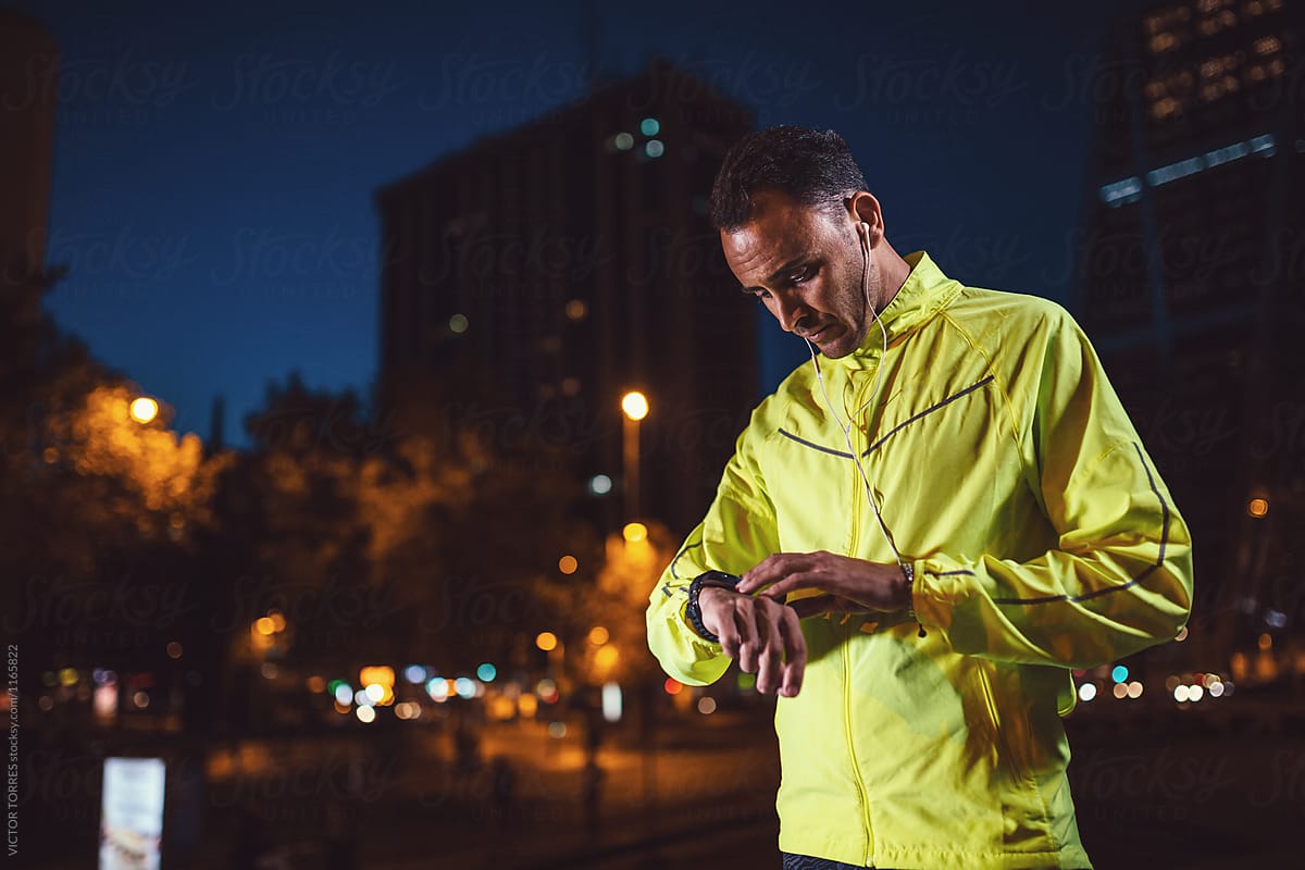 "Handsome Athlete In Yellow Checking Time" by Stocksy Contributor ...