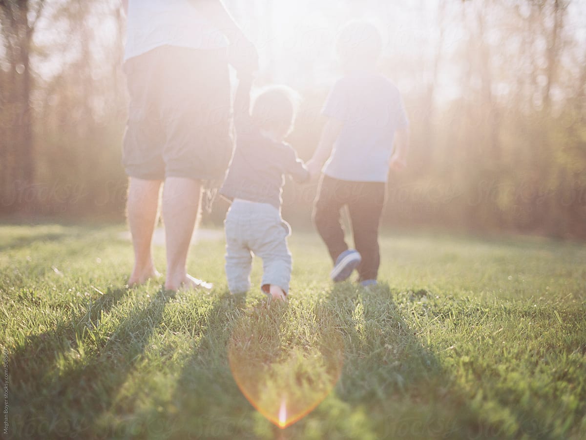 "Father Walking With Two Young Sons" by Stocksy Contributor "Meghan ...