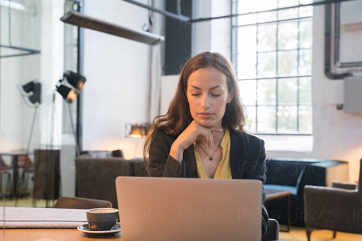 "Entrepreneur Woman Using Laptop In Cafe" by Stocksy Contributor ...