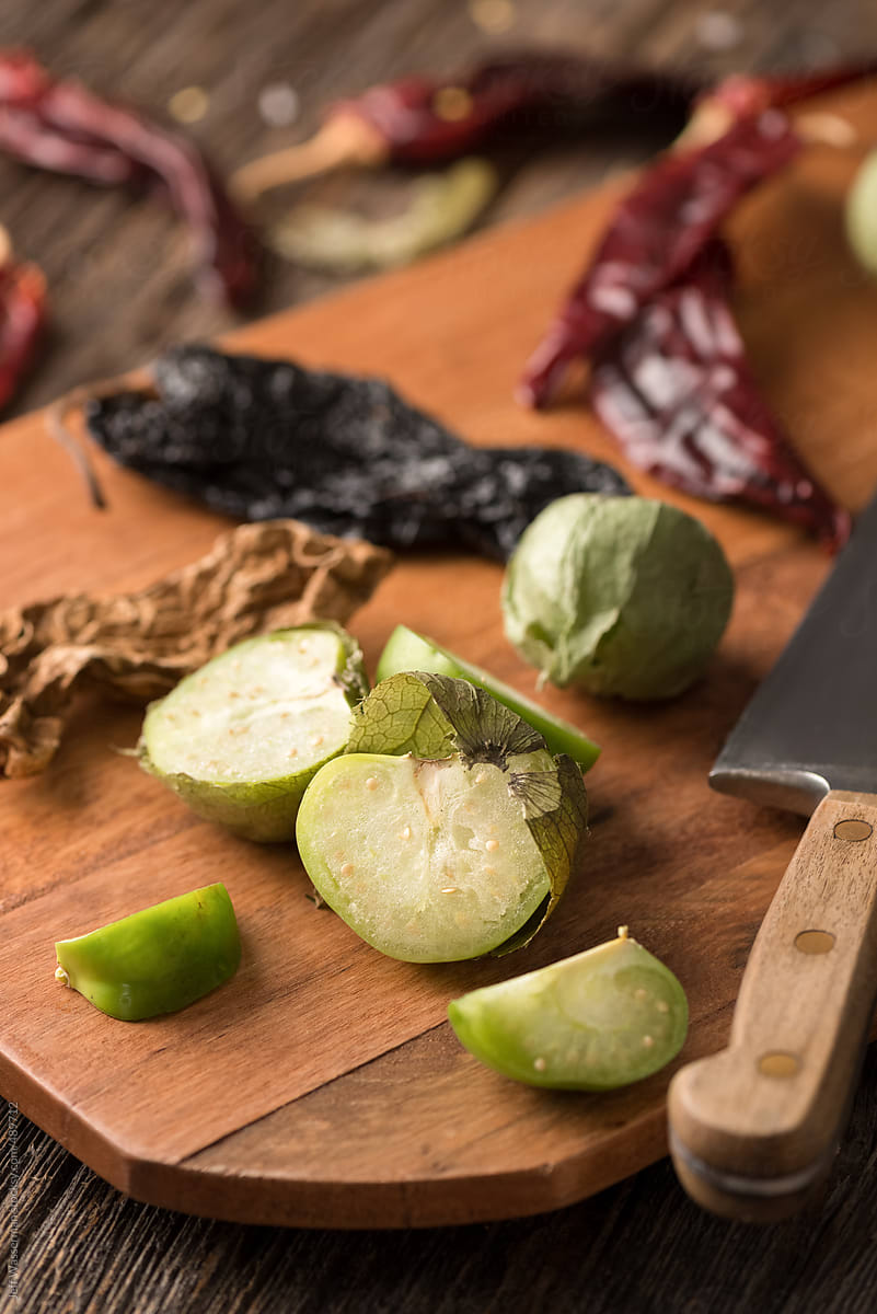 Mexican Food Ingredients Tomatillos With Chile Peppers By Stocksy Mexican Food Ingredients Tomatillos With Chile Peppers By Stocksy