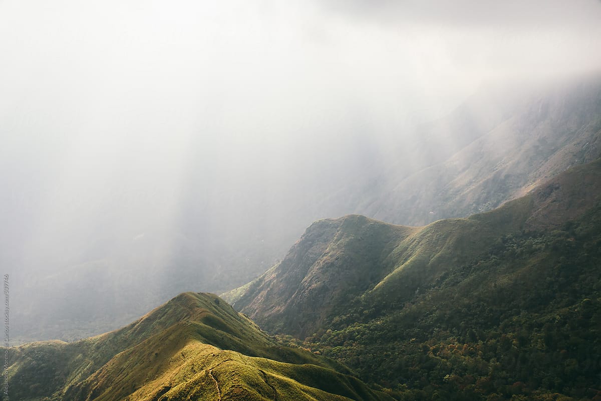 "Green Hills On Mountain Landscape With Light Rays Passing Through The ...