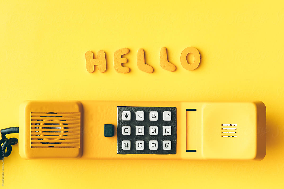"Friendly Hello Over Old Yellow Phone Handle" by Stocksy Contributor ...